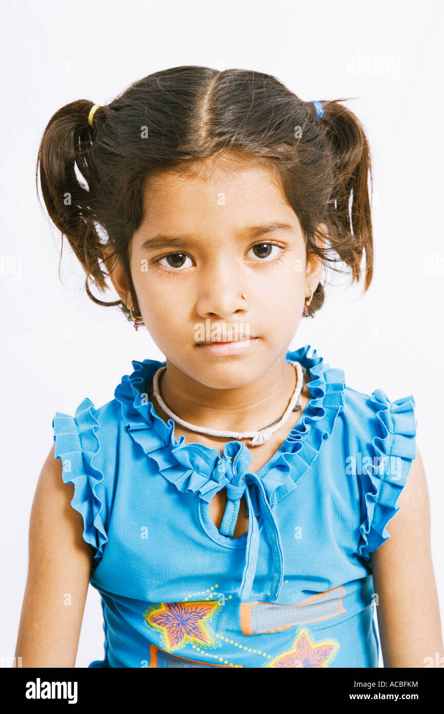 Portrait of a girl looking serious Stock Photo - Alamy