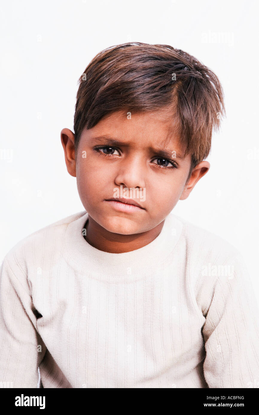 Portrait of a boy looking sad Stock Photo - Alamy
