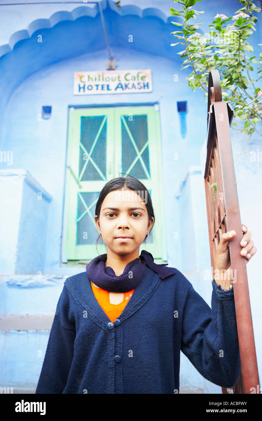 Portrait of a teenage girl standing near a gate Stock Photo - Alamy