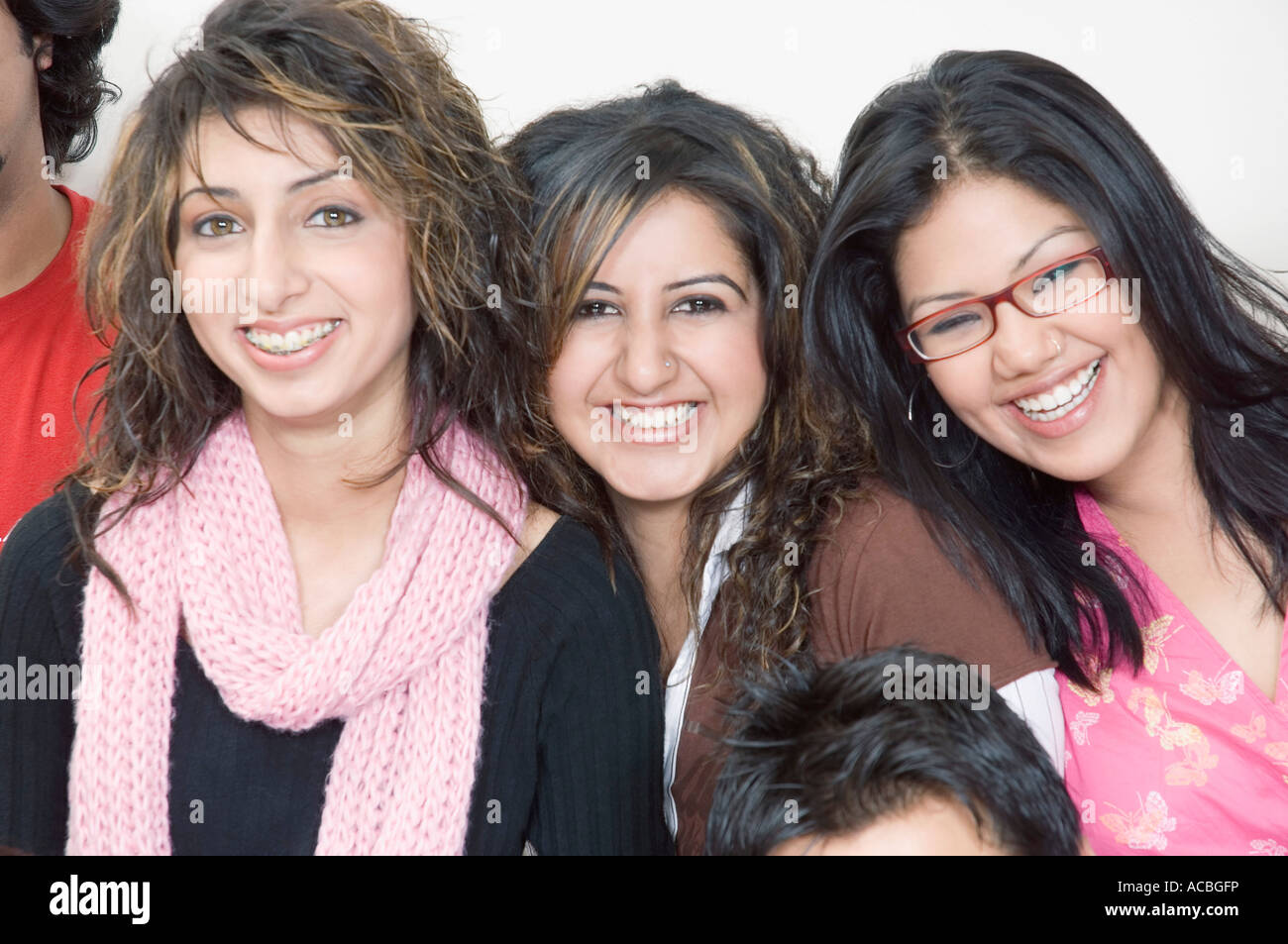Portrait of three college students smiling Stock Photo - Alamy