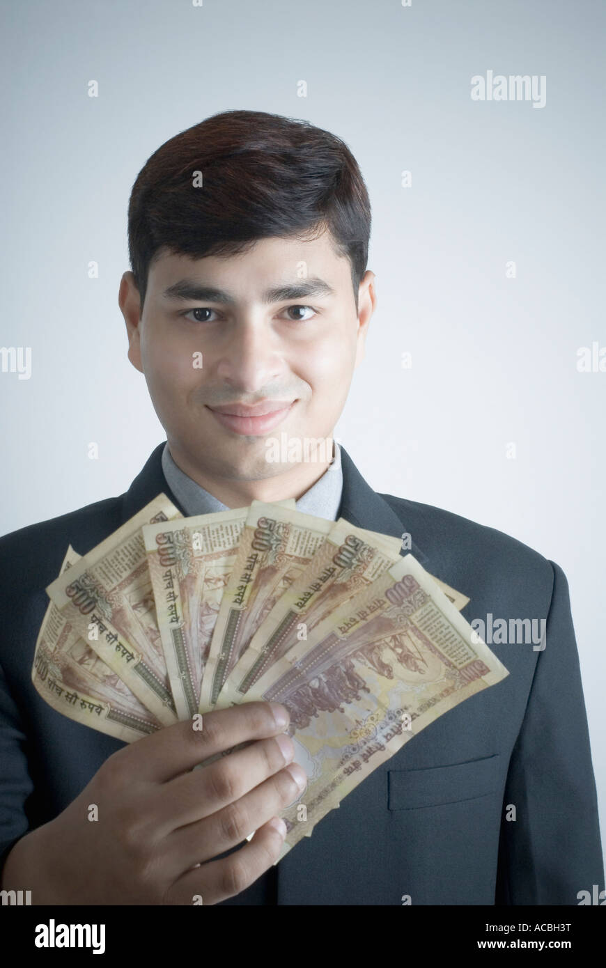 Man holding indian rupee notes hi-res stock photography and images - Alamy