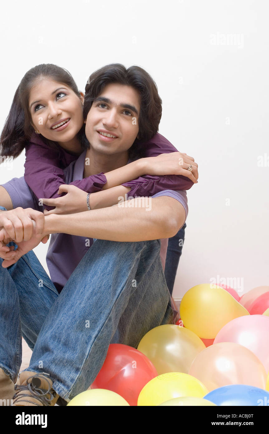 Cuddling from behind hi-res stock photography and images - Alamy