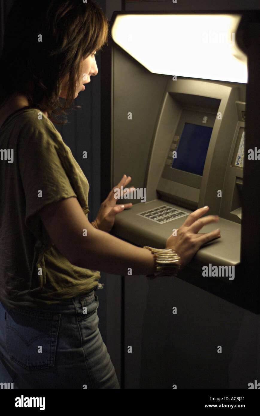Woman cash point night hi-res stock photography and images - Alamy