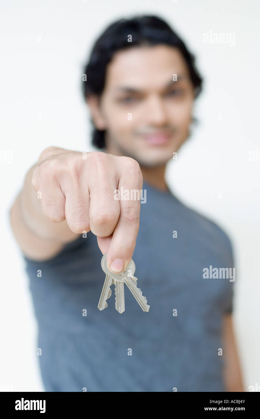 Man smiling holding keys hi-res stock photography and images - Alamy