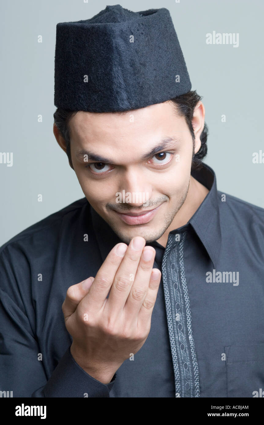 Portrait of a young man greeting Stock Photo - Alamy