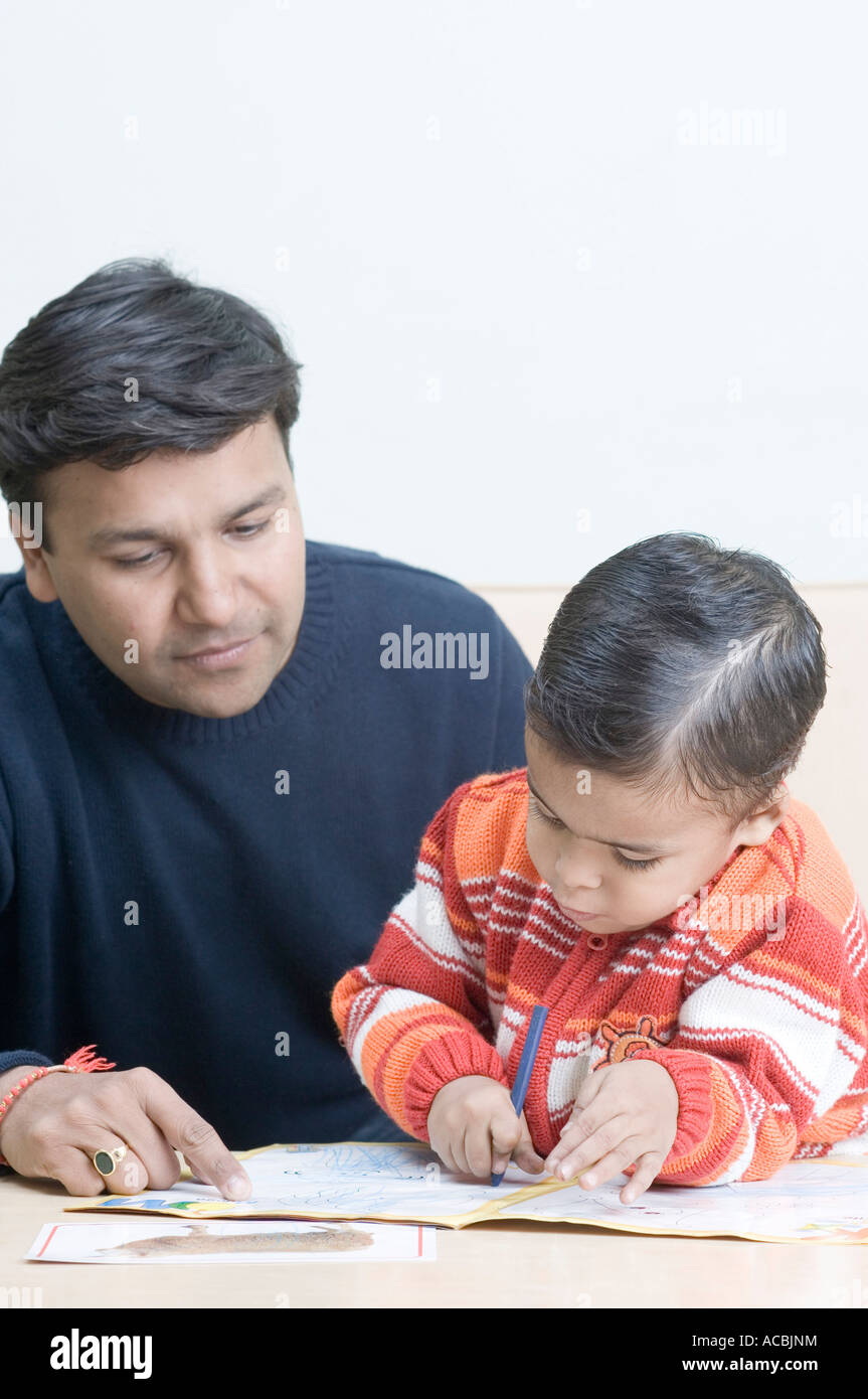 Father helping son draw hi-res stock photography and images - Alamy