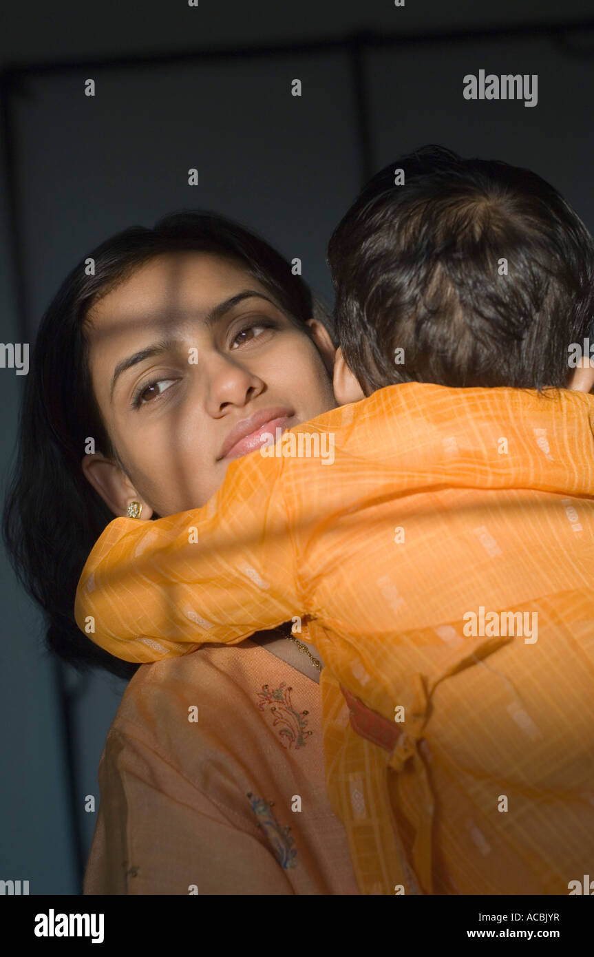Close-up of a mother hugging her son Stock Photo - Alamy