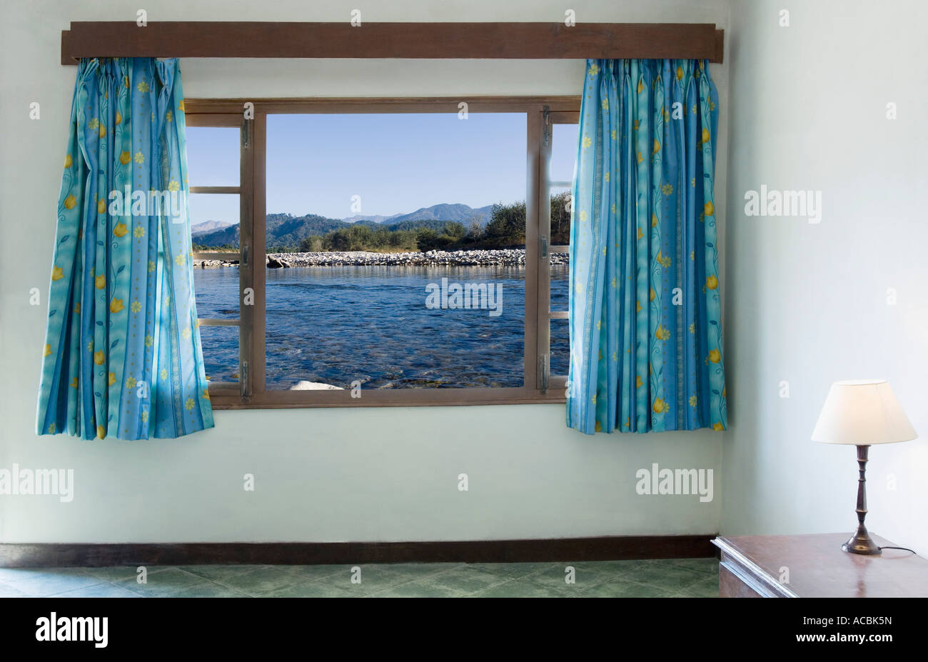 Panoramic view of a river through a window, Jim Corbett National Park ...