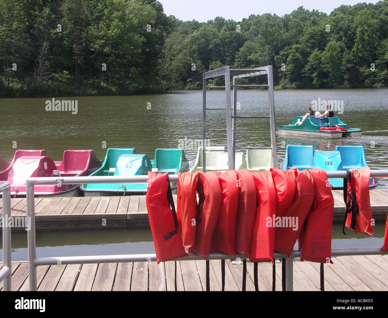 Life Jackets hanging on railing Stock Photo - Alamy