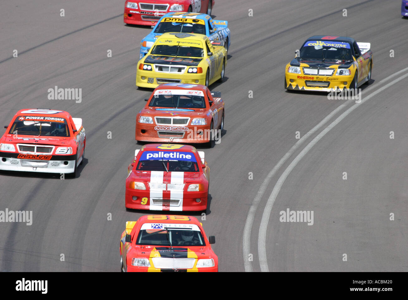 Racing pick up trucks racing around a banked circuit Stock Photo - Alamy