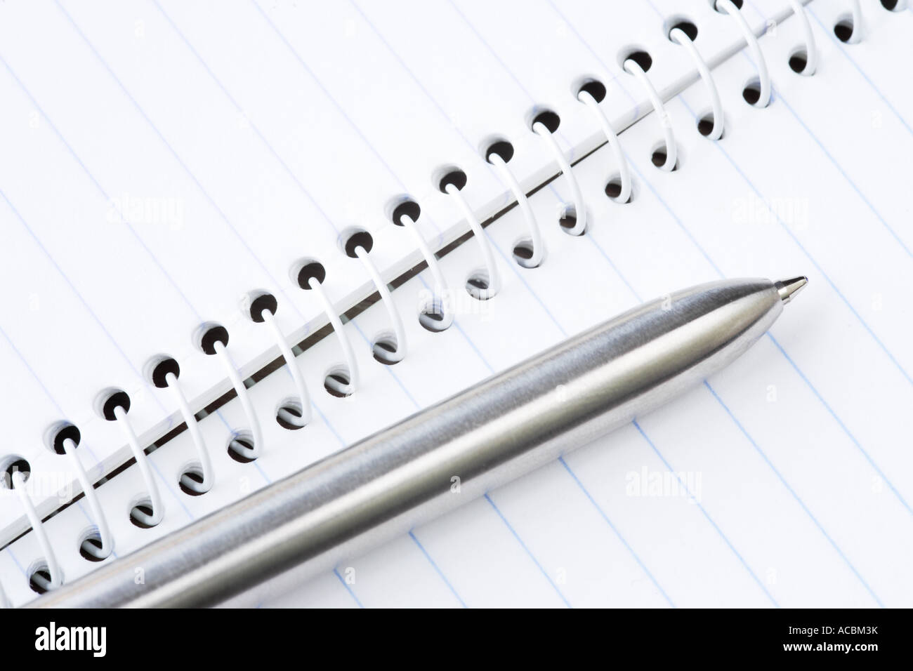 Pen on notebook Stock Photo - Alamy