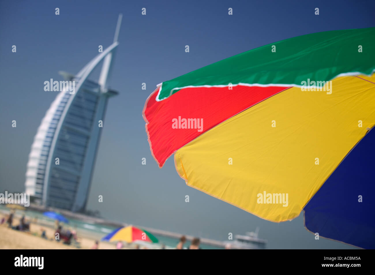 Colourful parasol on Umm Suqeim Public Beach, Dubai with the Burj Al ...