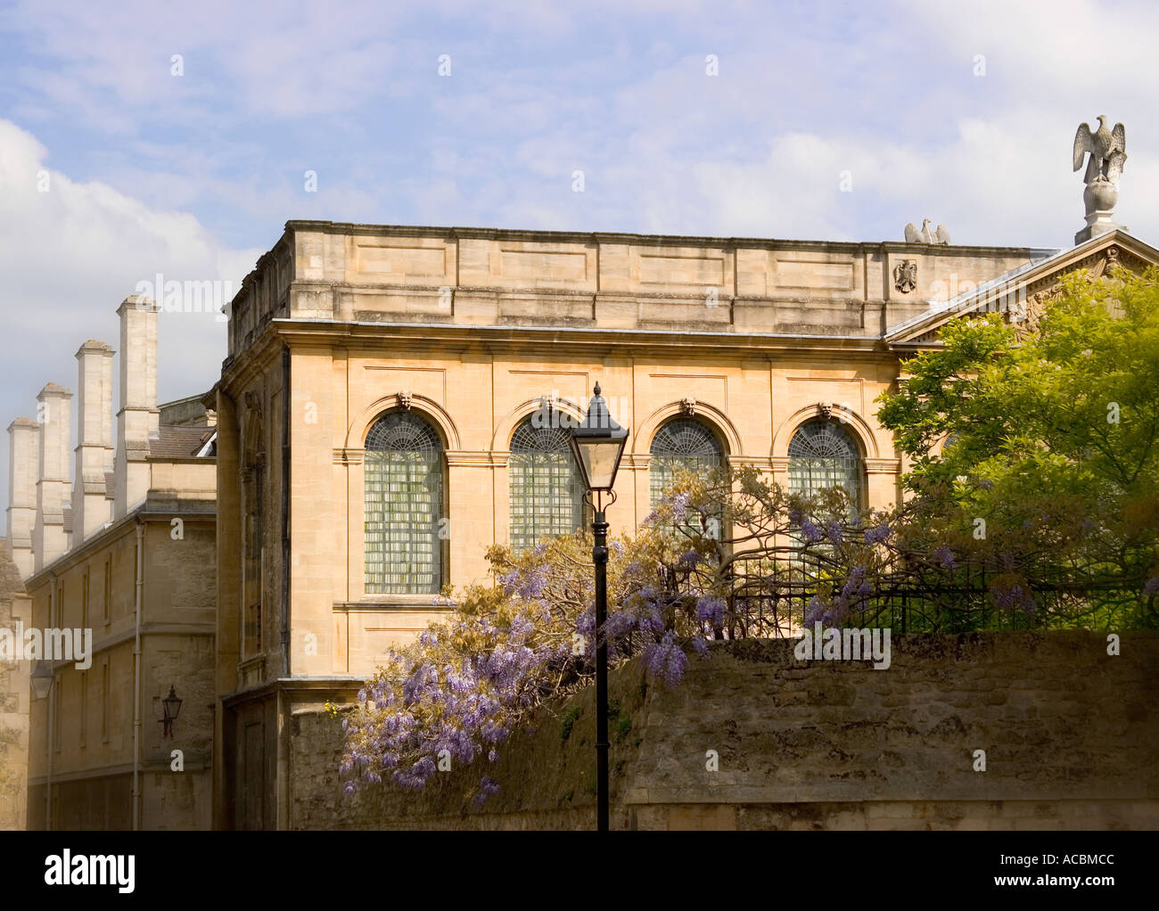 Cambridge University building with large leaded glass arched windows ...