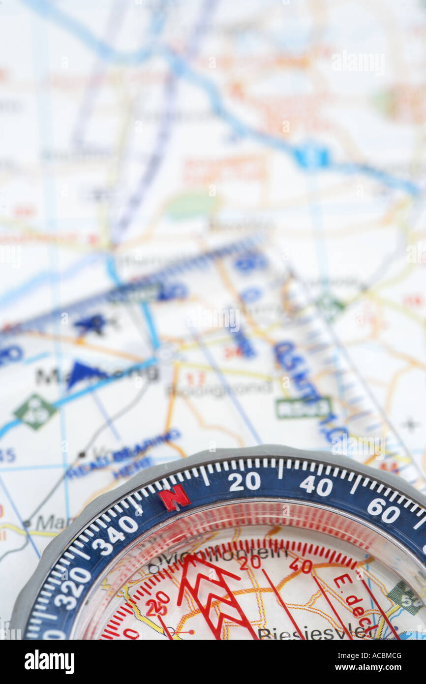 Compass on map Stock Photo - Alamy