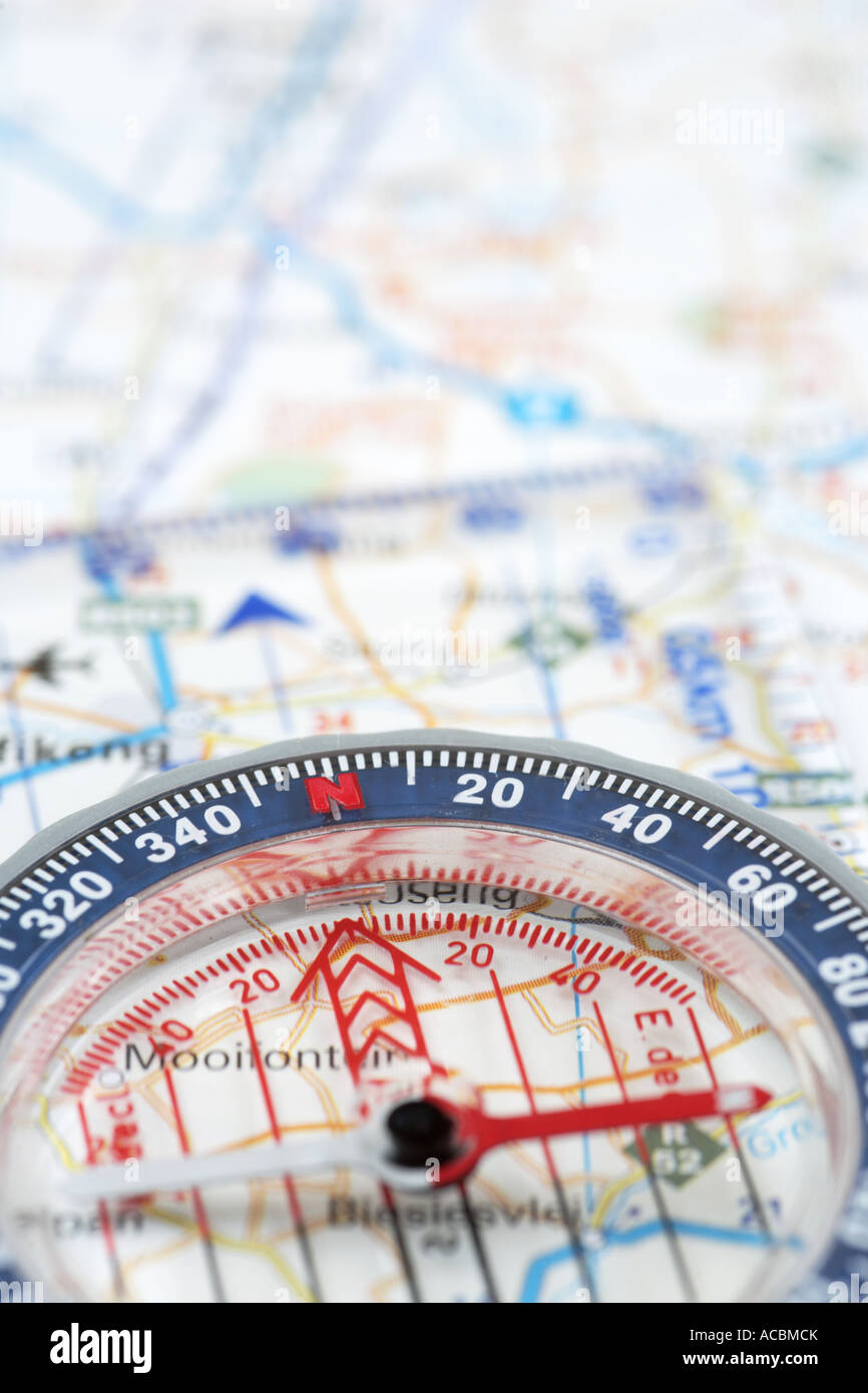 Compass on map Stock Photo - Alamy
