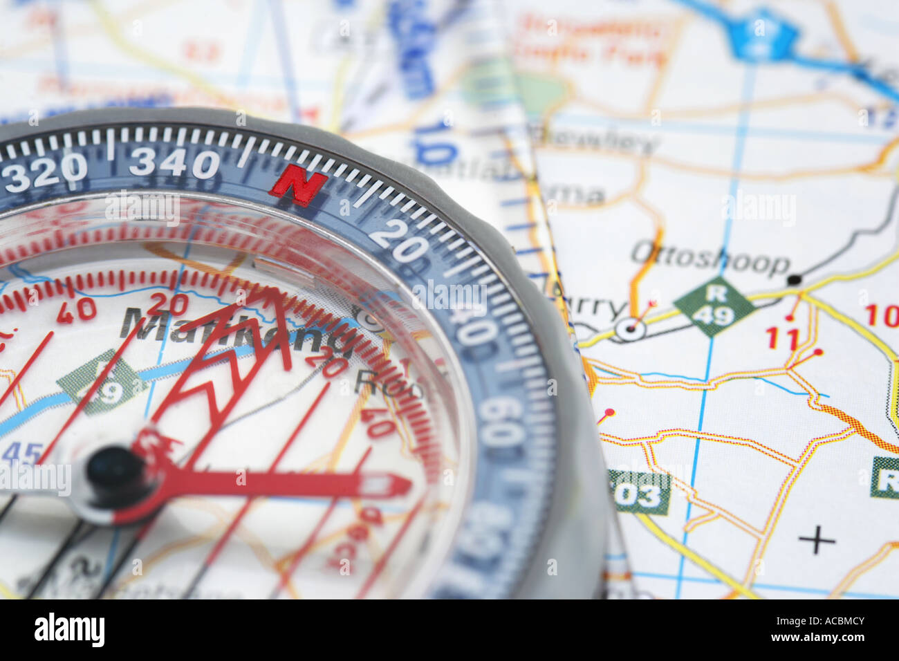 Compass on map Stock Photo - Alamy