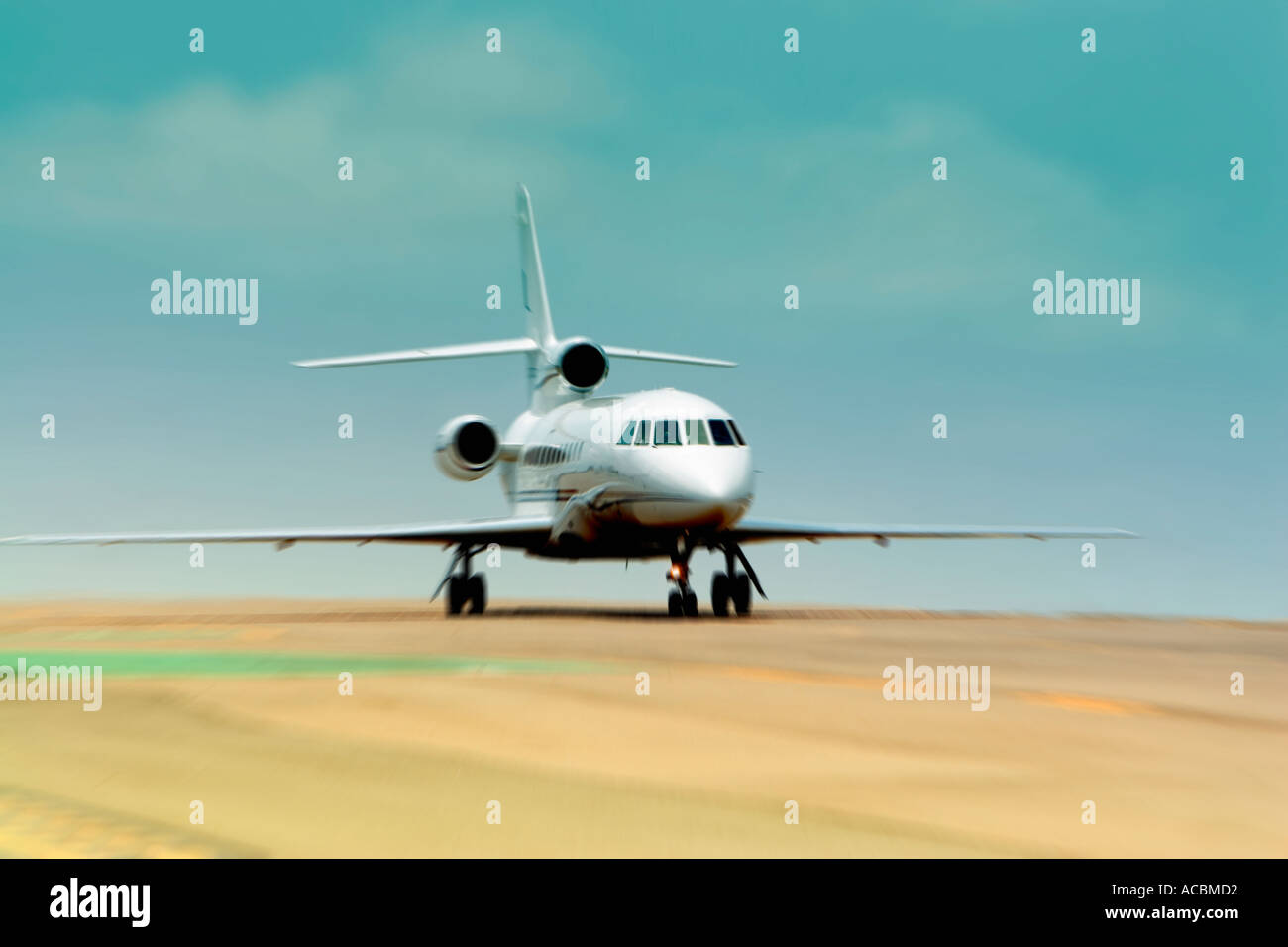 Corporate jet on runway Stock Photo - Alamy