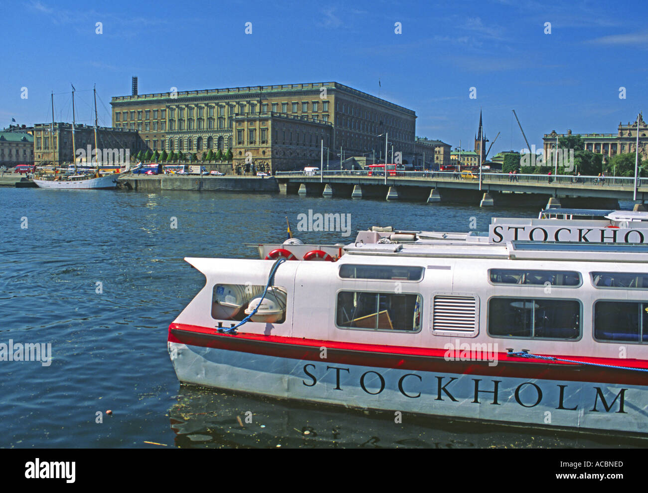 Moored sightseeing vessels in Stockholm harbour with the Royal Palace ...