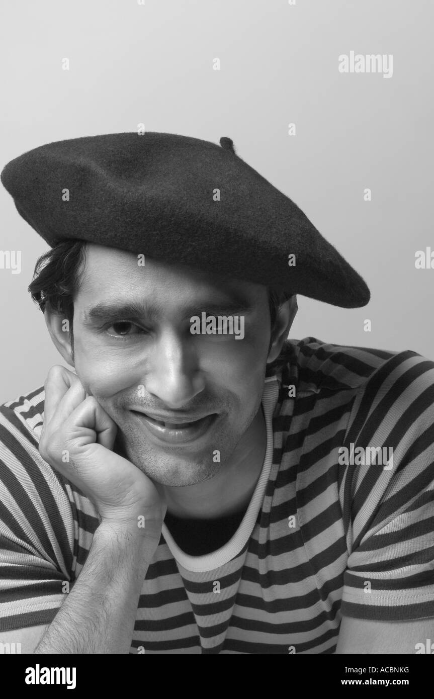 Portrait of a mid adult man smirking Stock Photo - Alamy