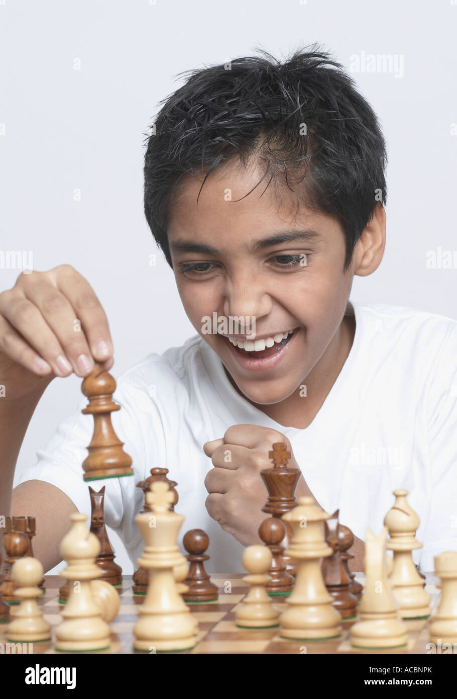 Close-up of a boy playing chess Stock Photo - Alamy