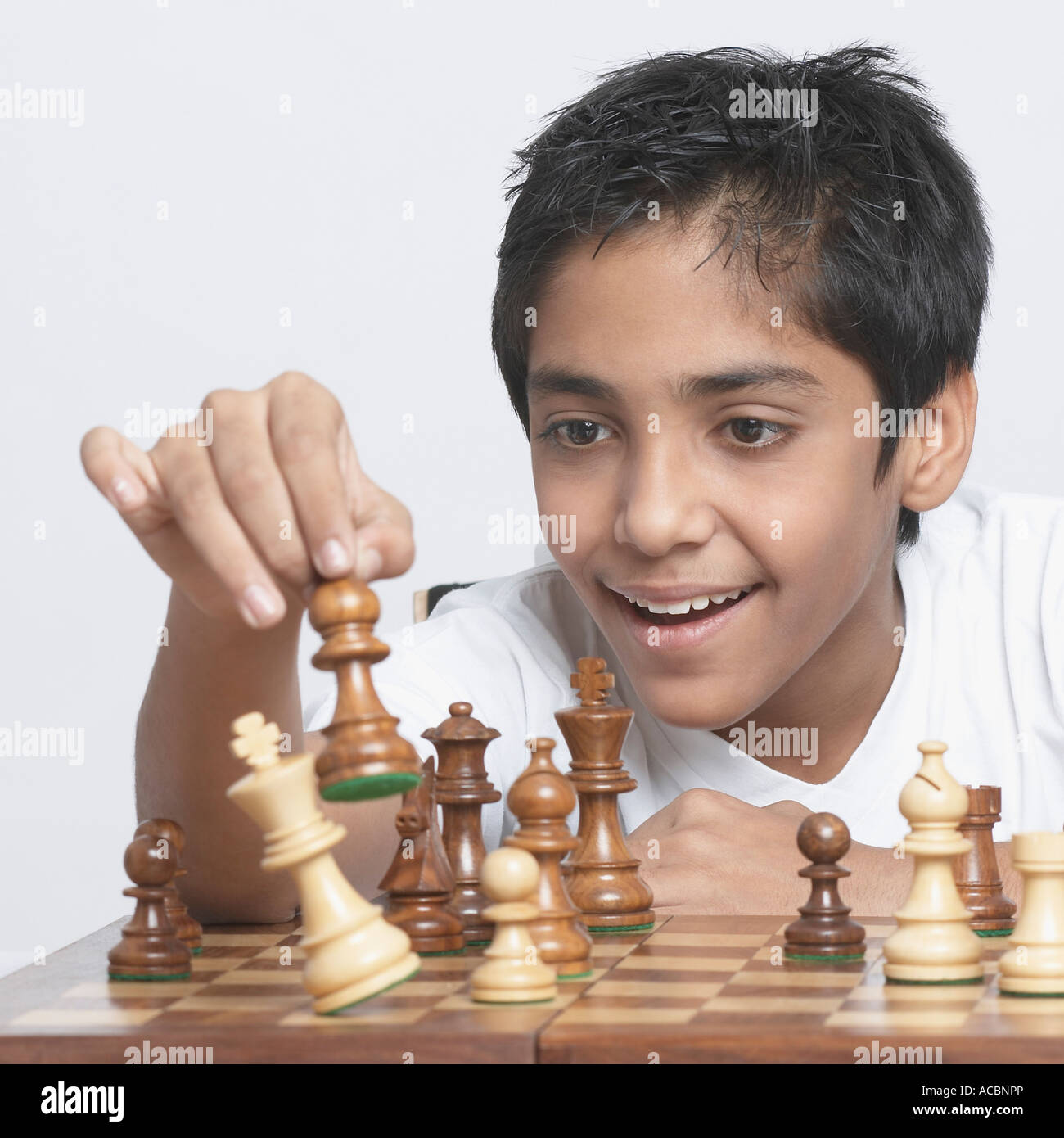 Close-up of a boy playing chess Stock Photo - Alamy