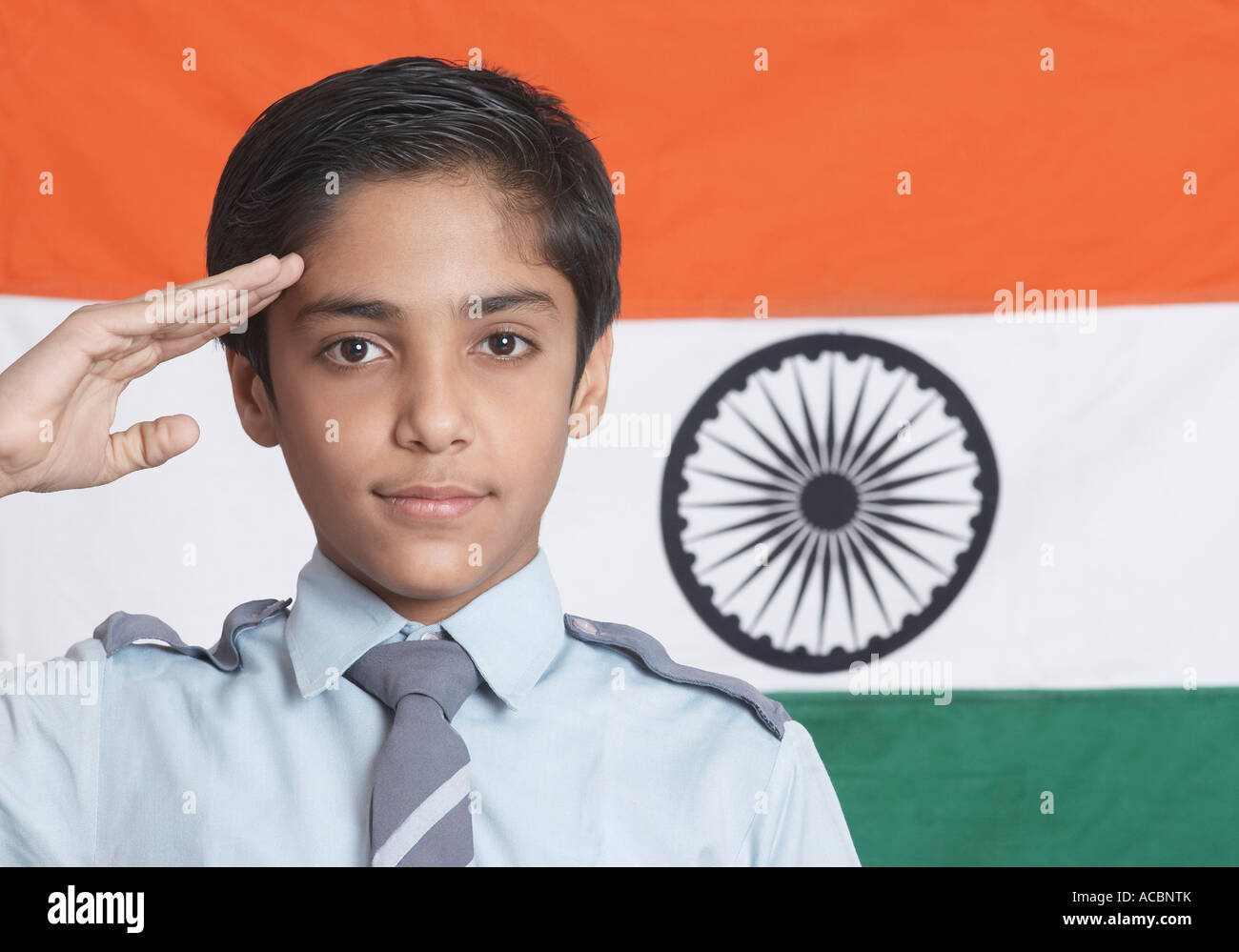 Close-up of a boy saluting in front of the Indian Flag Stock Photo - Alamy
