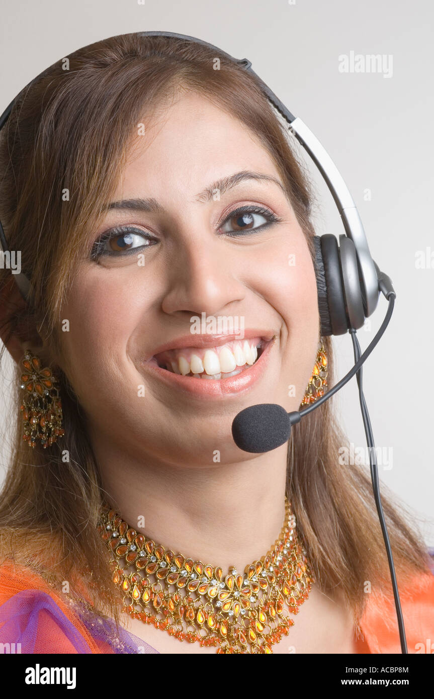 Portrait of a young woman wearing a headset Stock Photo - Alamy