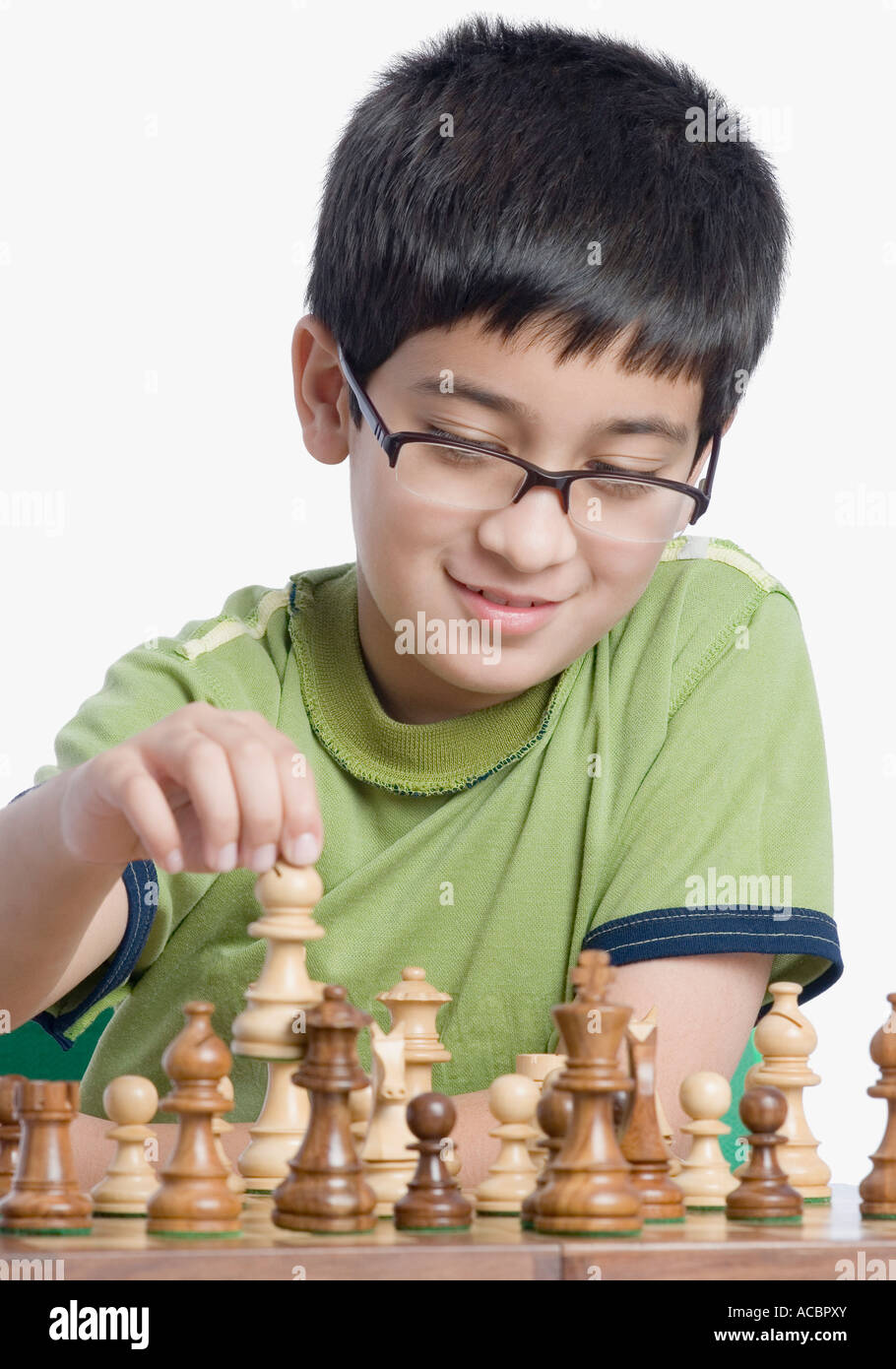 Close-up of a boy playing chess Stock Photo - Alamy