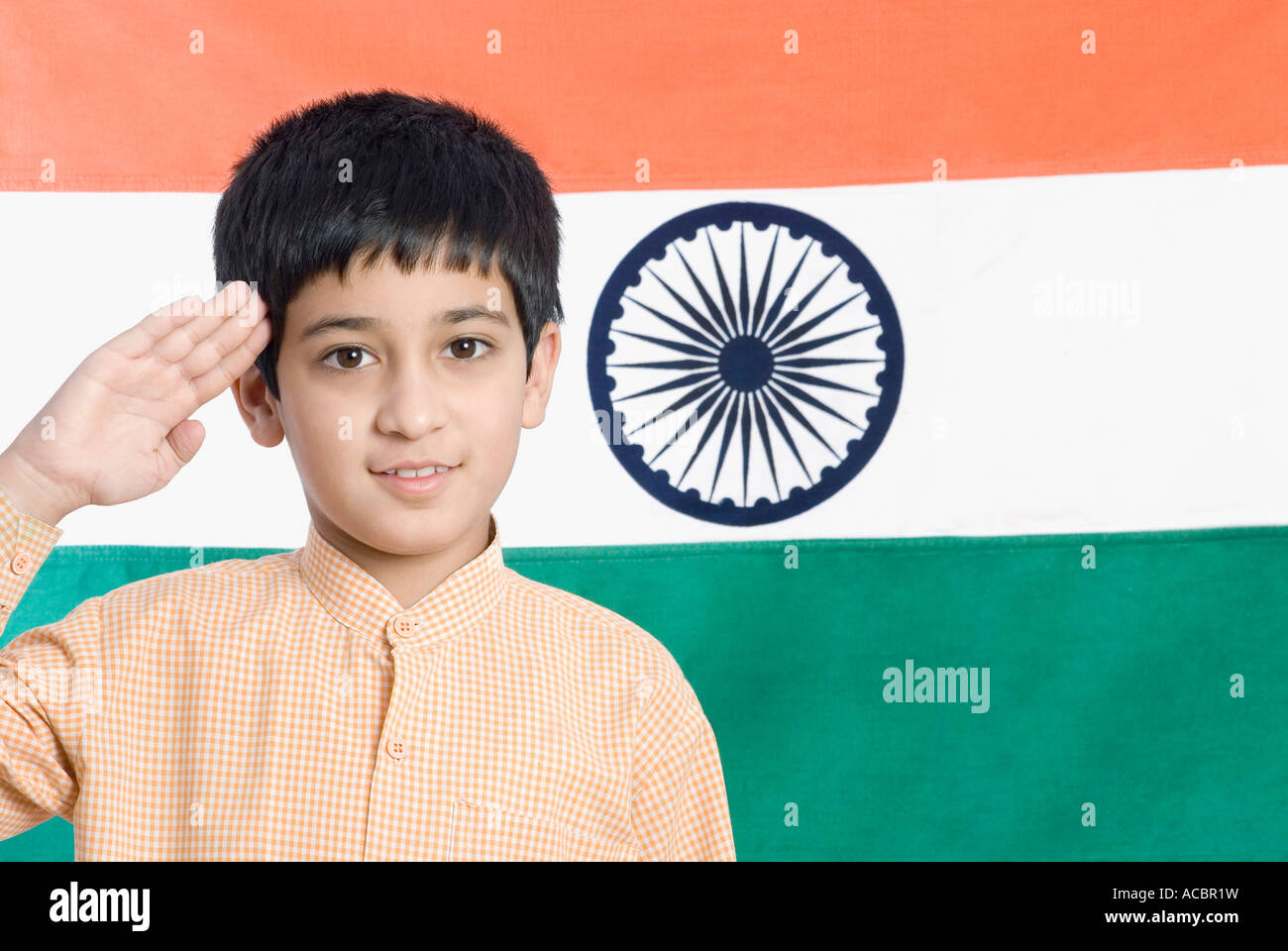 Close-up of a boy saluting in front of the Indian flag Stock Photo - Alamy