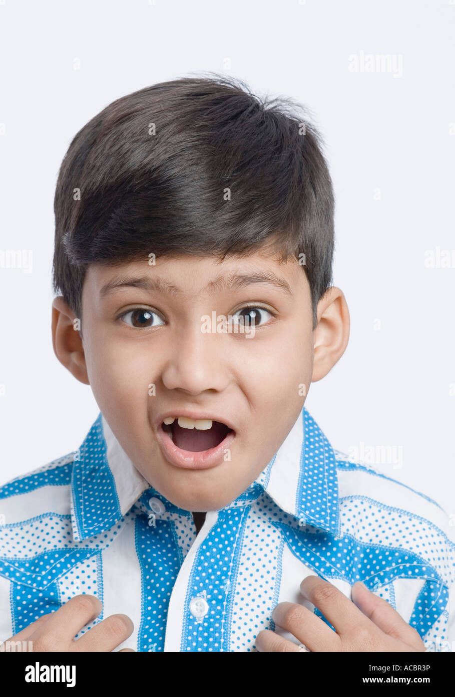 Portrait of a boy looking surprised Stock Photo - Alamy