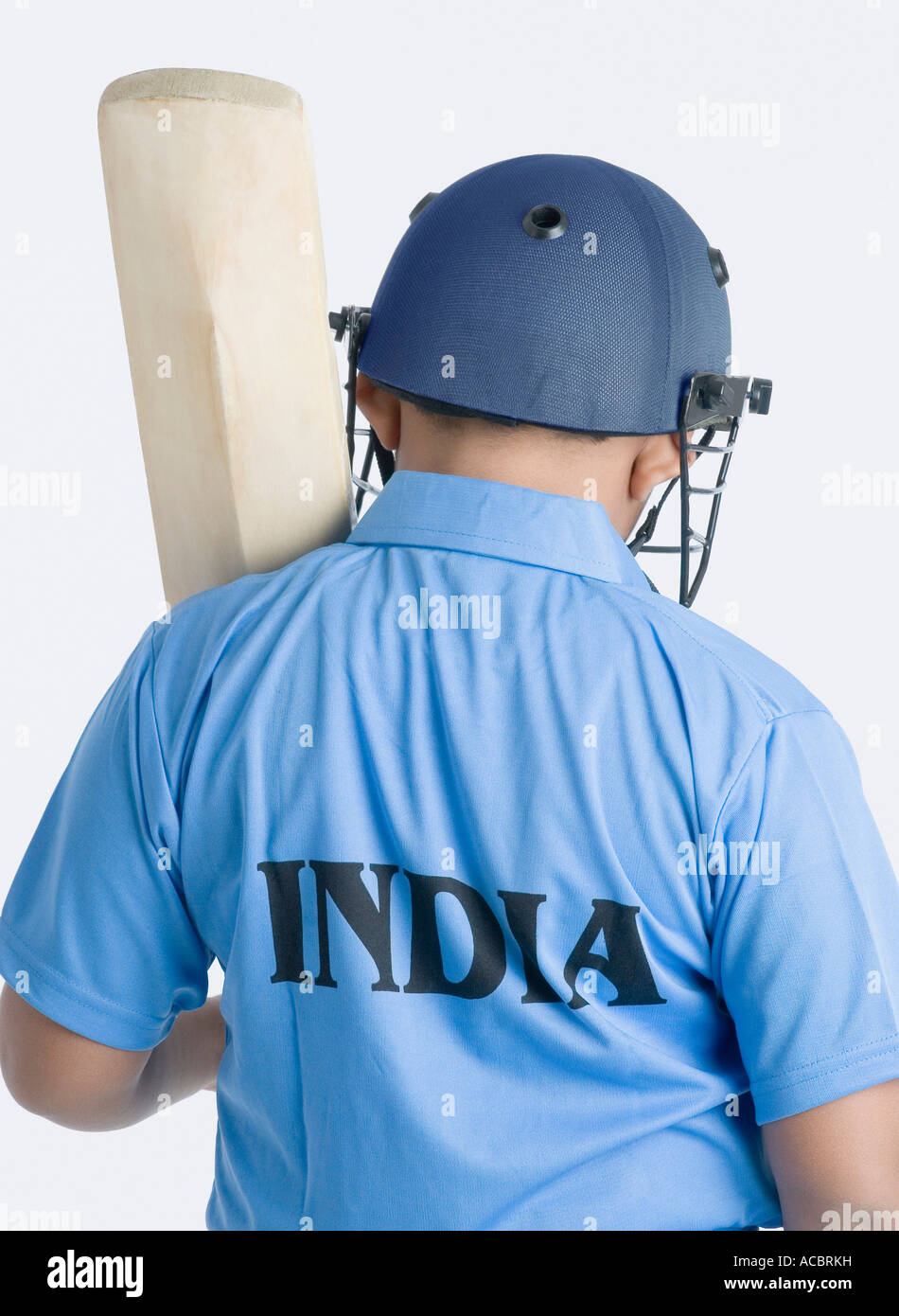 Rear view of a boy holding a cricket bat Stock Photo - Alamy