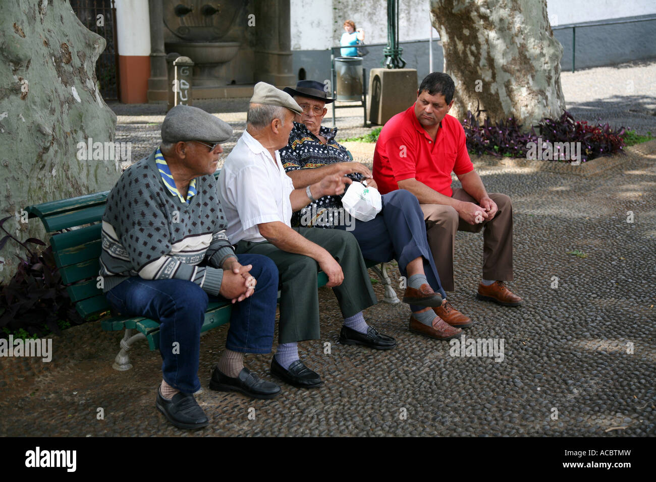Madeira - A quiet chat in a shady square in Machico Stock Photo - Alamy