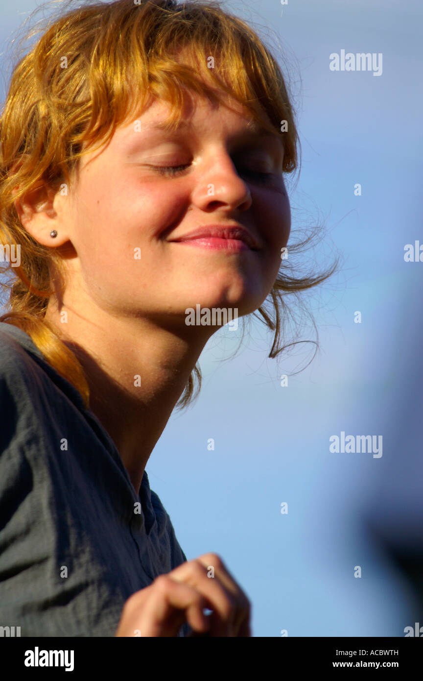 Happy teenage red head girl dancing at rave party Hilltop 2007 Stock ...