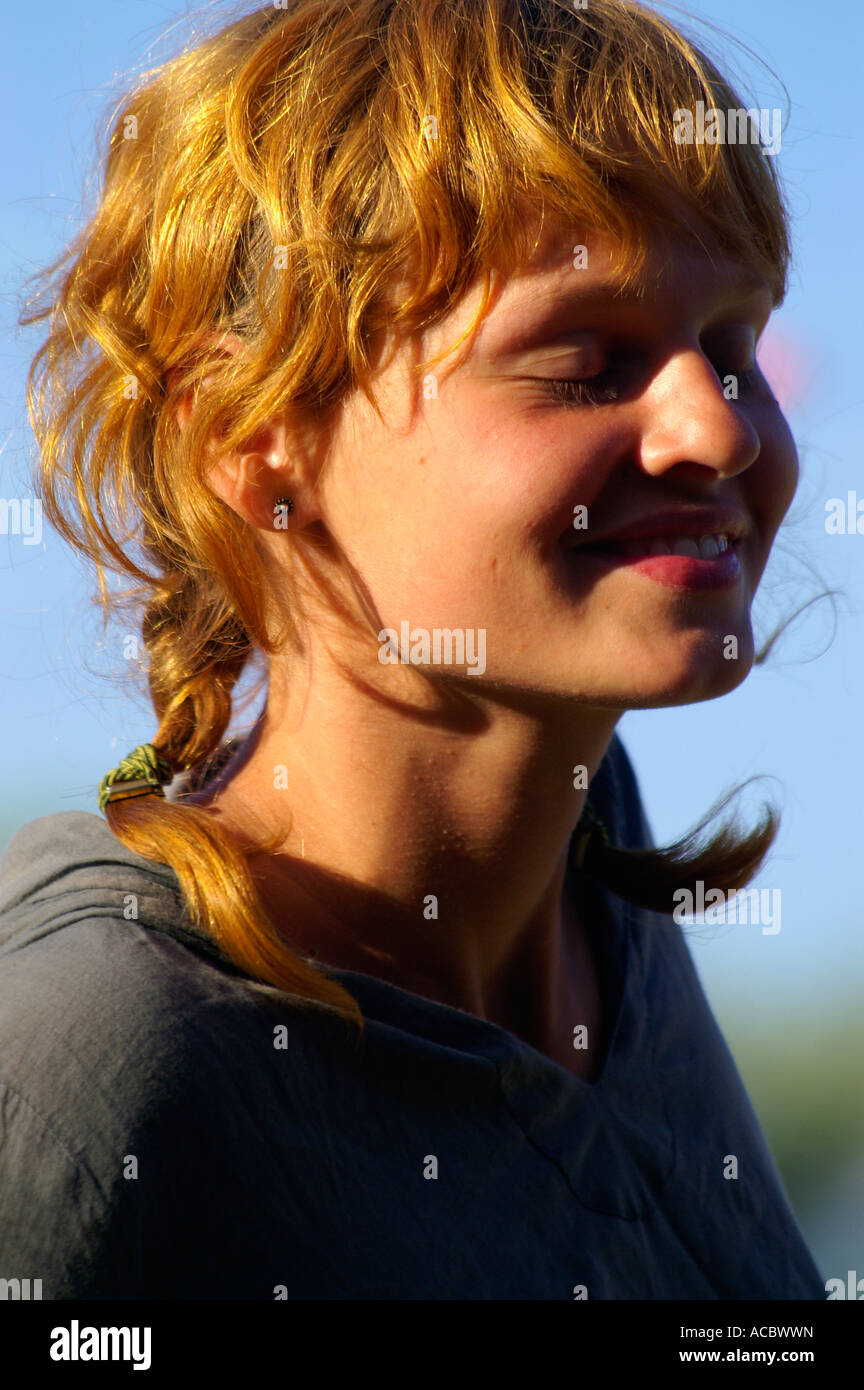 Happy teenage red head girl dancing at rave party Hilltop 2007 Stock ...