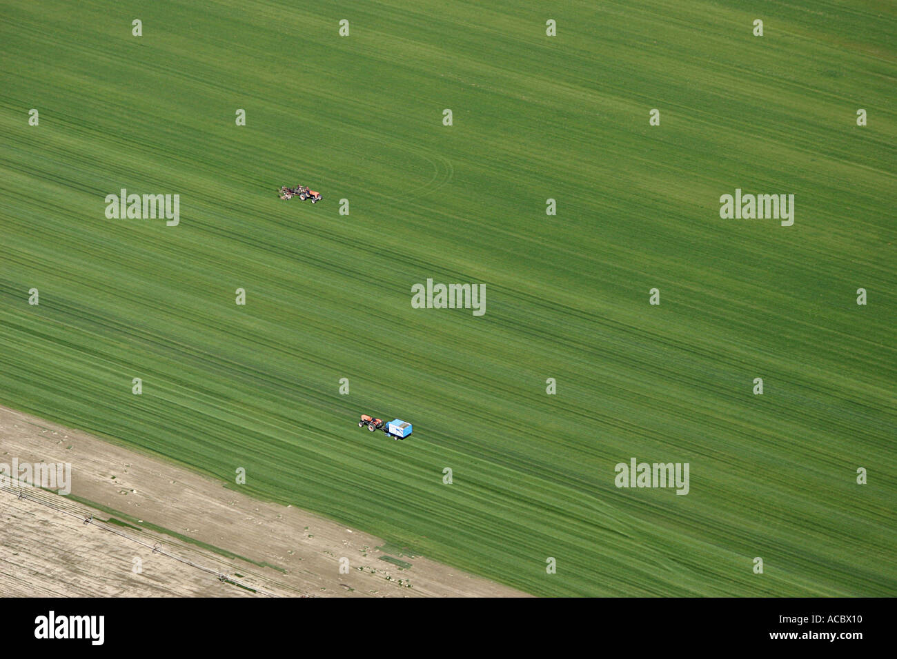 Aerial photo of farmer on tractor harvesting alphalpha Stock Photo - Alamy