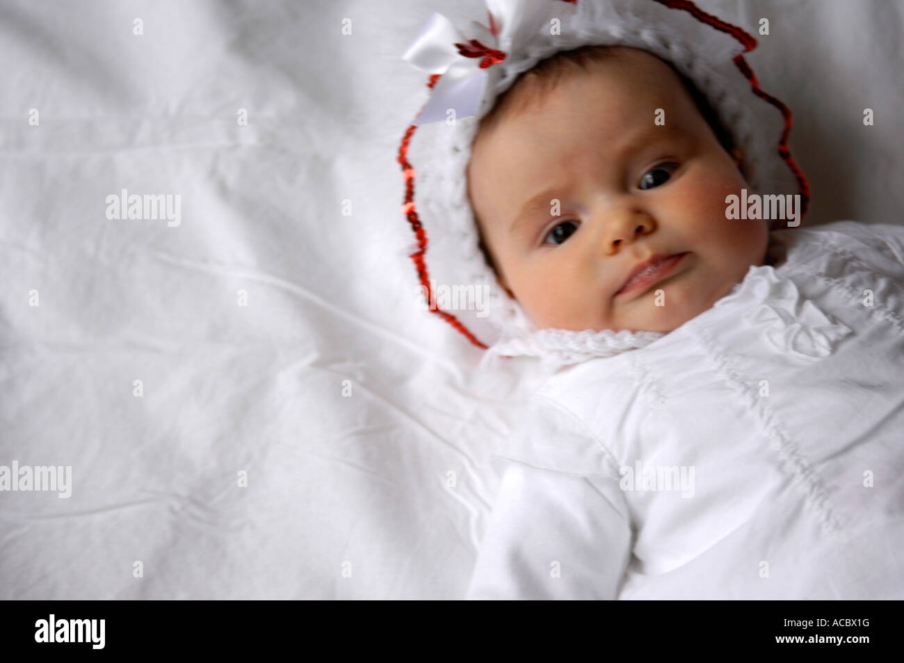 baby bonnet hat white red portrait face child infant colour color cute ...