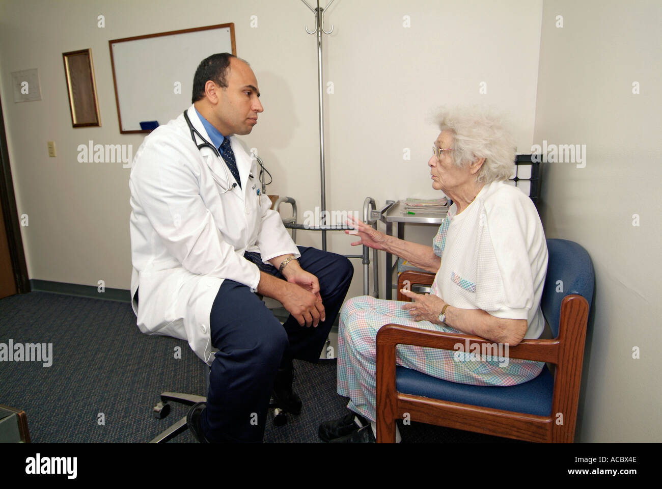 Senior 85 year old female has medical check up with doctor physician ...