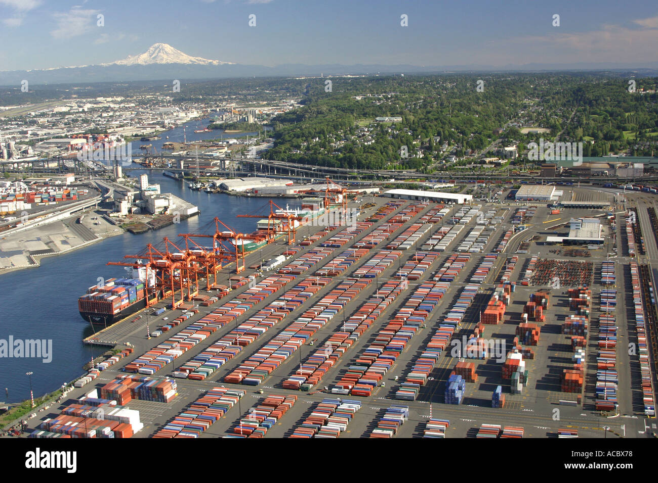 Aerial view of shipping containers at Port of Seattle with Mt Rainier ...