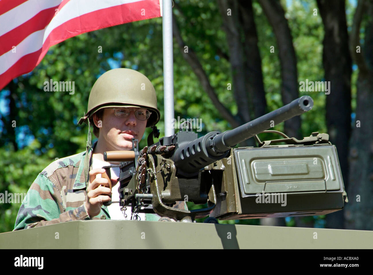 Soldier at machine gun at Independence Day parade at Lexington Michigan ...