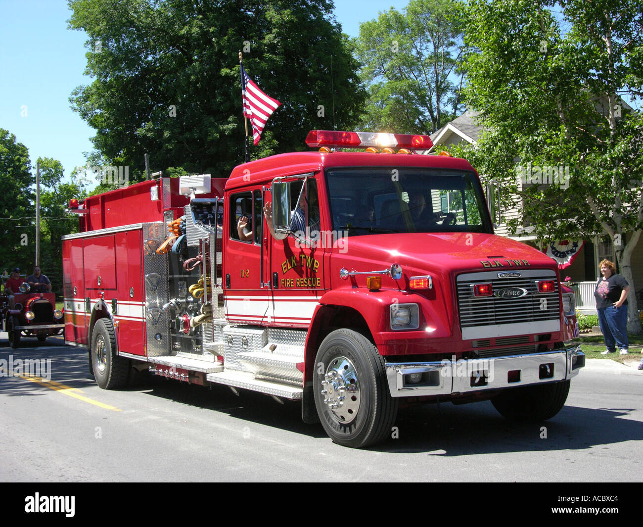 Current and vintage historic fire trucks at Independence Day parade at ...