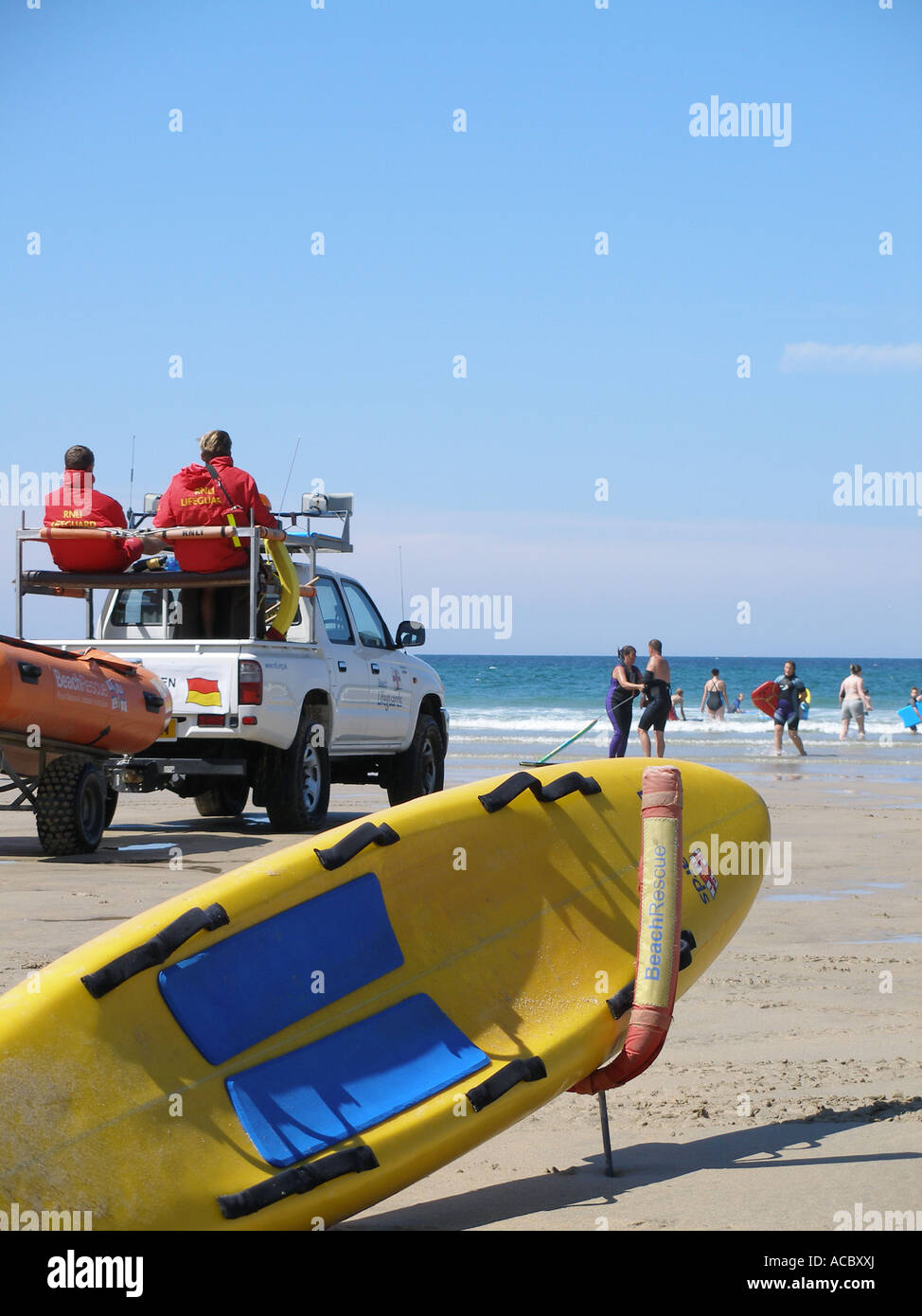 Cornwall beach in summertime with lifeguard vehicle, lifeguards and ...