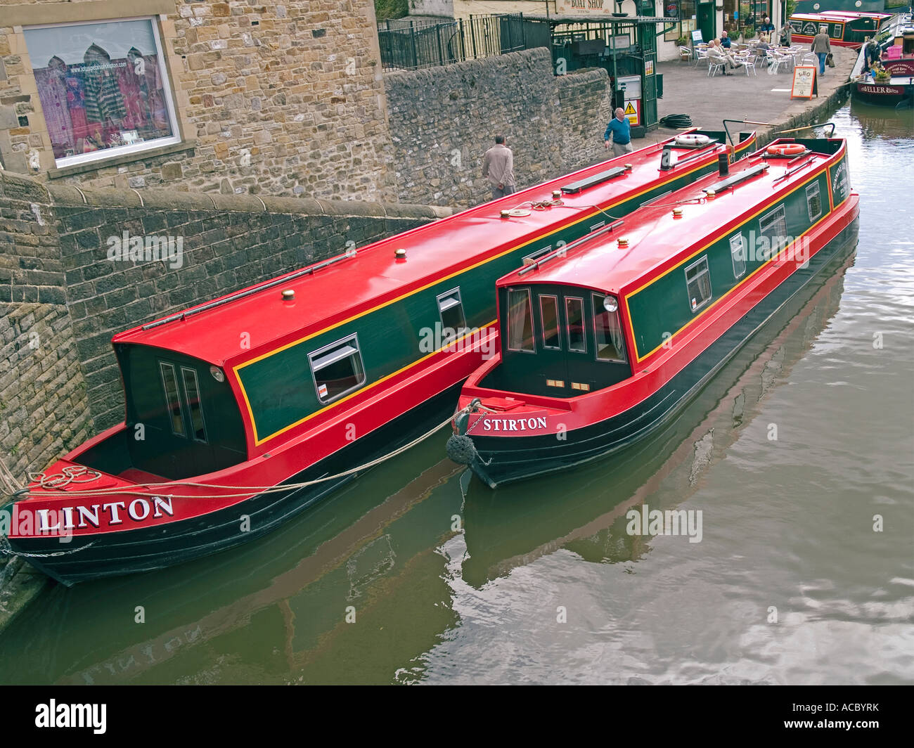 Two red painted canal narrow boats on the Leeds Liverpool canal in ...