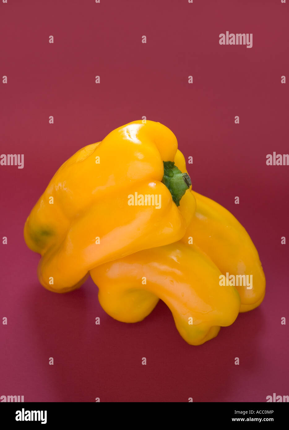 Close-up studio picture of yellow peppers Stock Photo - Alamy