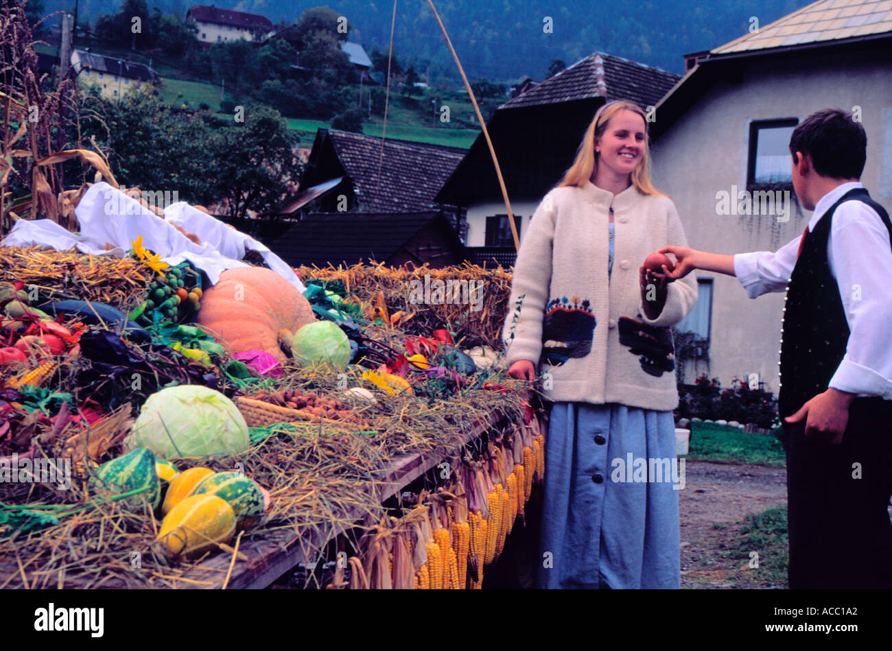 A Tyrolean girl and boy participate in traditional harvest festival ...