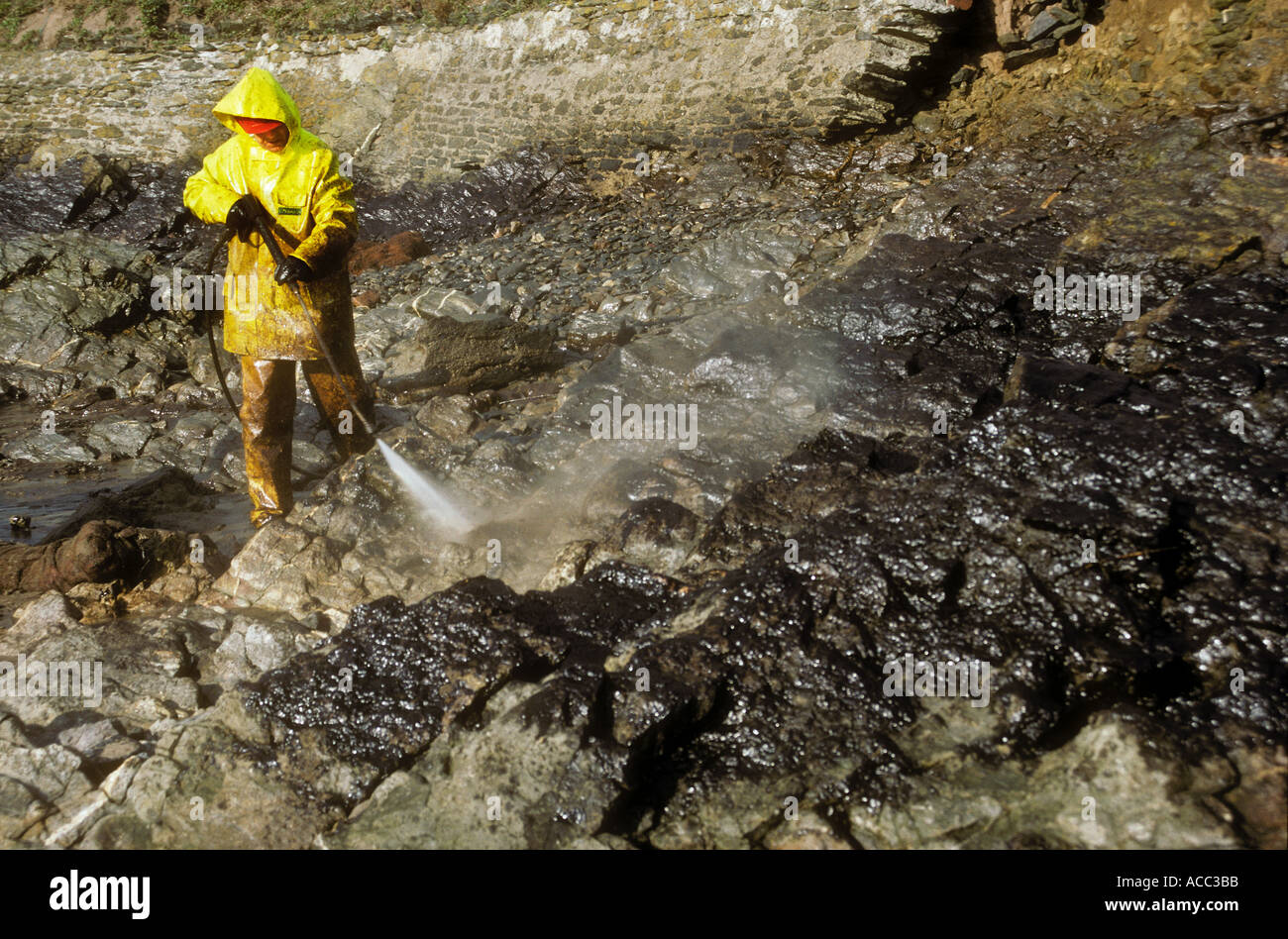 Cleaning oil from polluted beach after Sea Empress disaster in 1996 ...