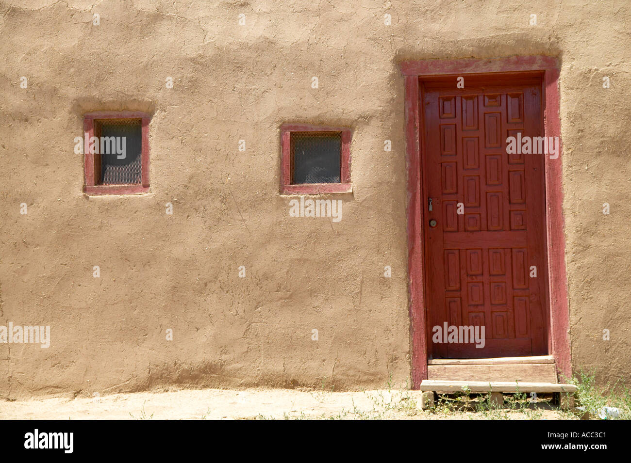 A very red door in the Pueblo Stock Photo - Alamy