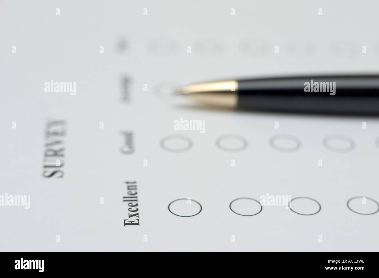 pen on survey form with the words excellent good average Stock Photo ...