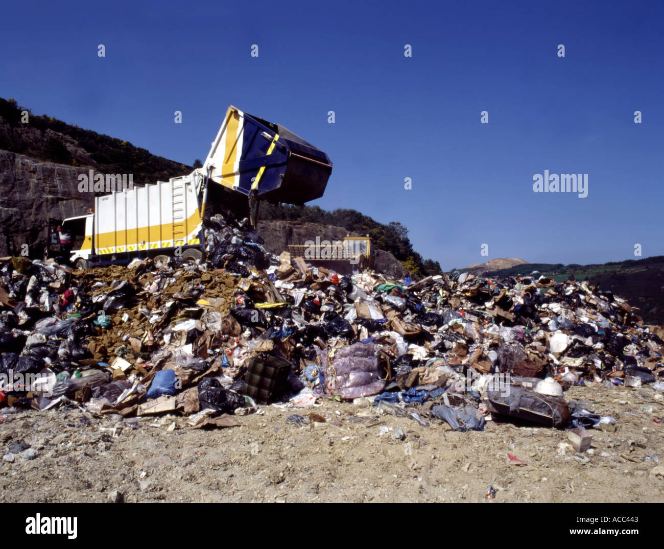A lorry empties garbage on a rubbish tip Stock Photo - Alamy
