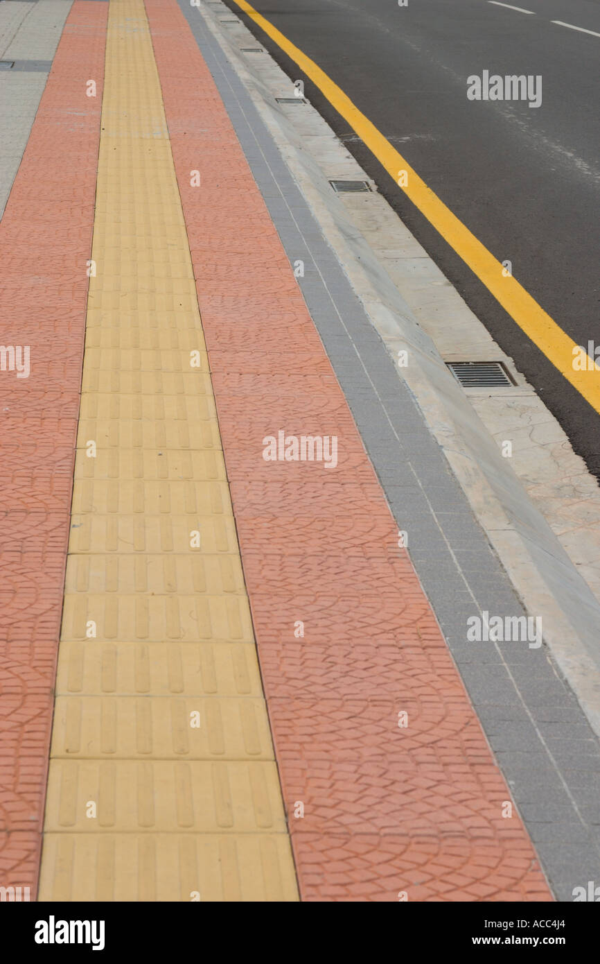 road pavement with trail for guiding blind people Stock Photo - Alamy