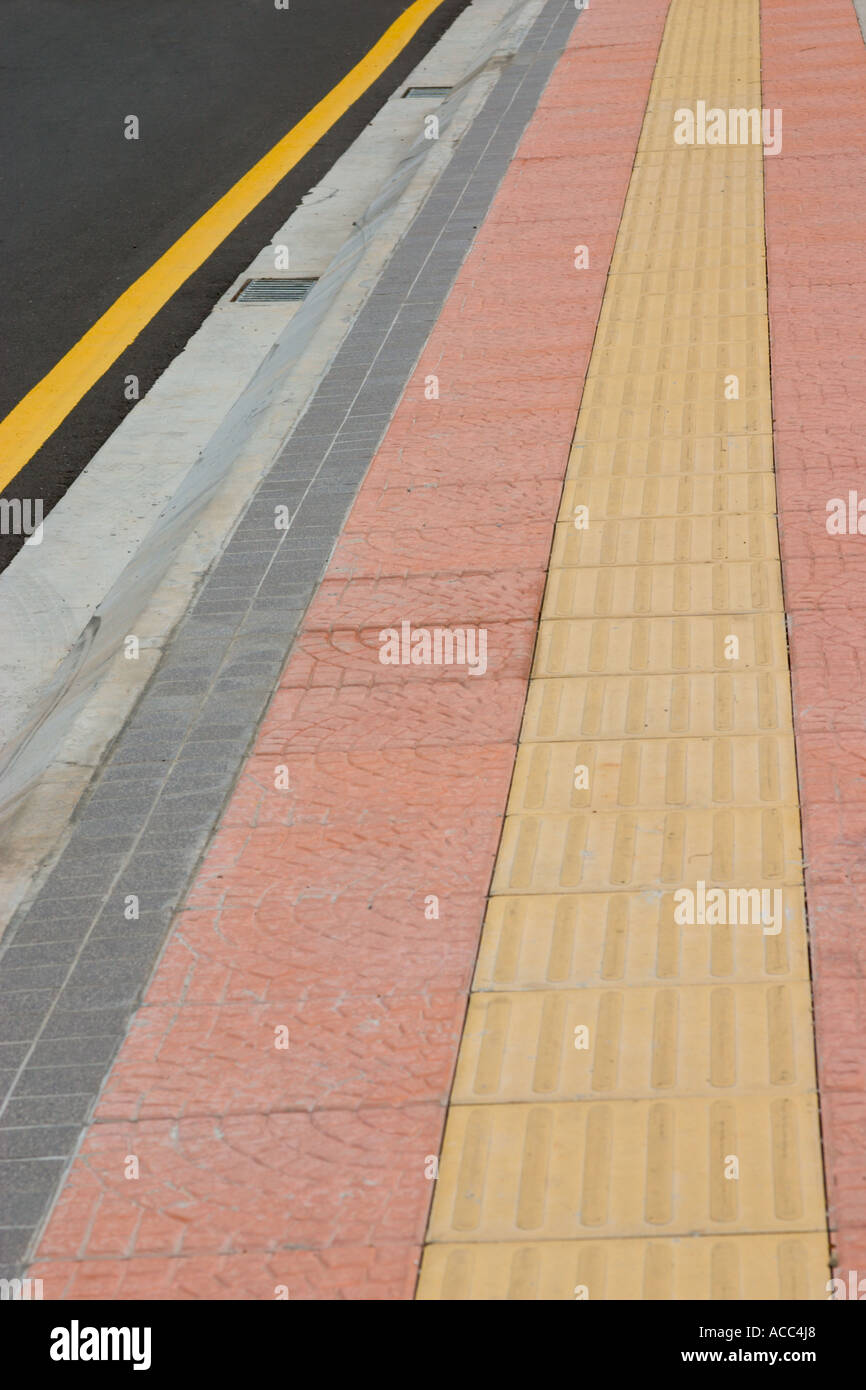 road pavement with trail for guiding blind people Stock Photo - Alamy